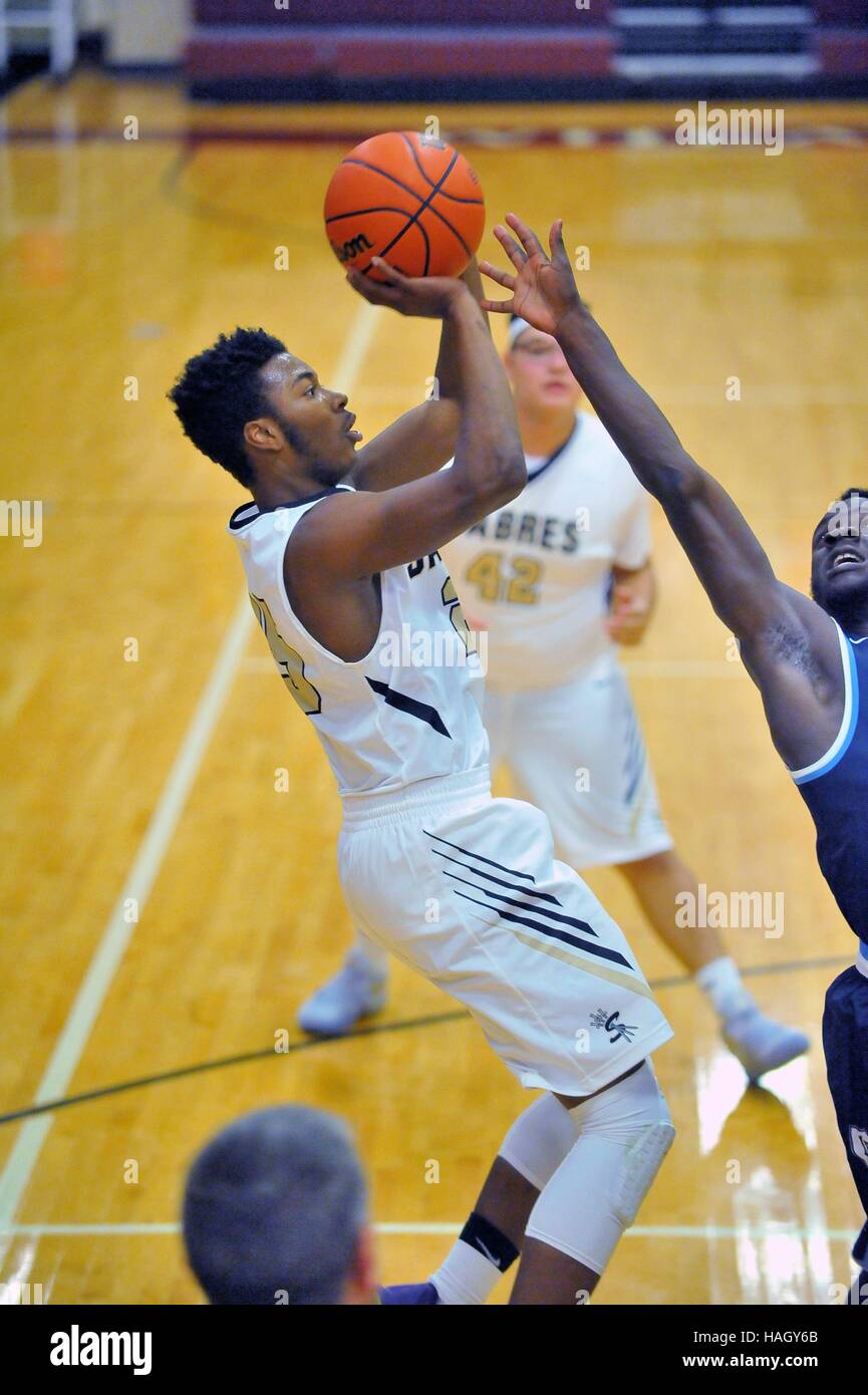 Forward taking a short jump shot over an opponent's blocking effort ...
