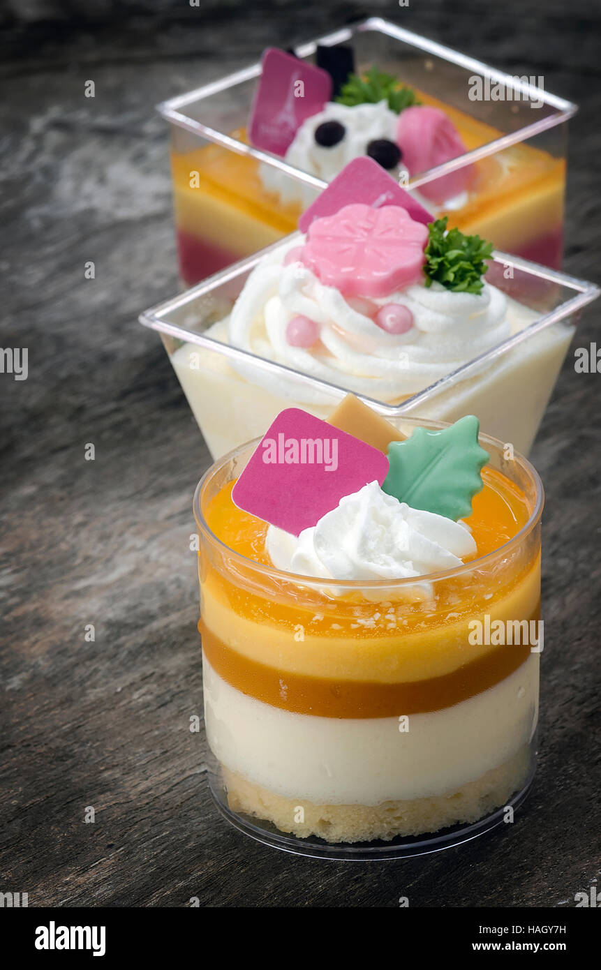 cup of lovely mousse cake on wooden background Stock Photo - Alamy