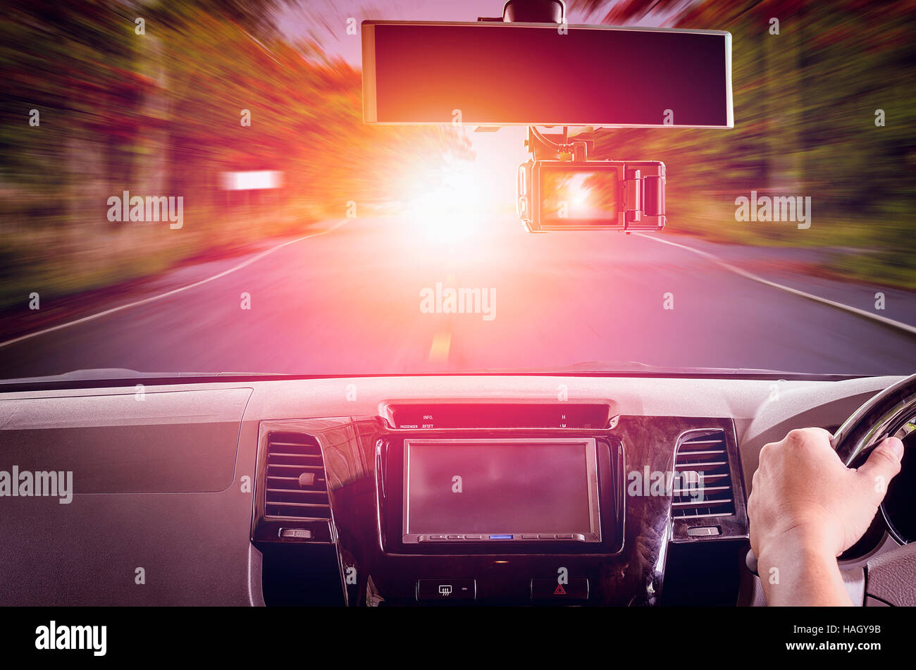 Fast driving into the light of the sun Stock Photo - Alamy