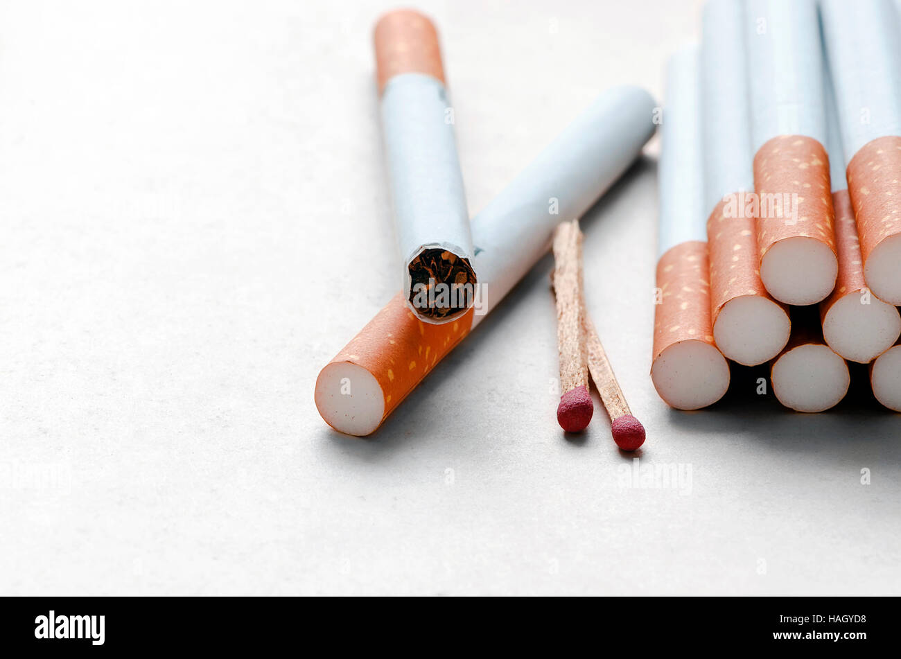 cigarettes and match on white paper background.Shallow DOF Stock Photo ...