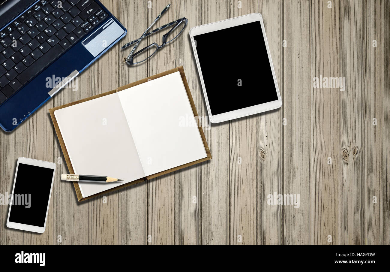 Office wooden desk table with computer, tablet,smartphone,blank ...