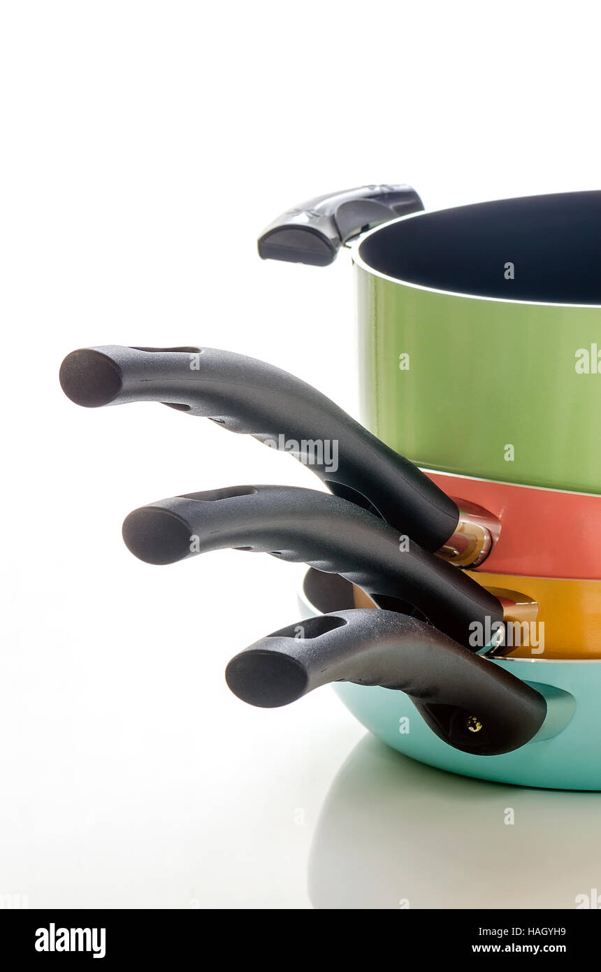 stack of colorful cooking pans on white background,close up view Stock ...