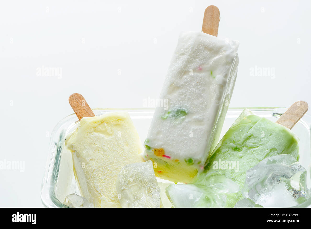homemade ice cream with ice cubes in the glass bowl on white background ...