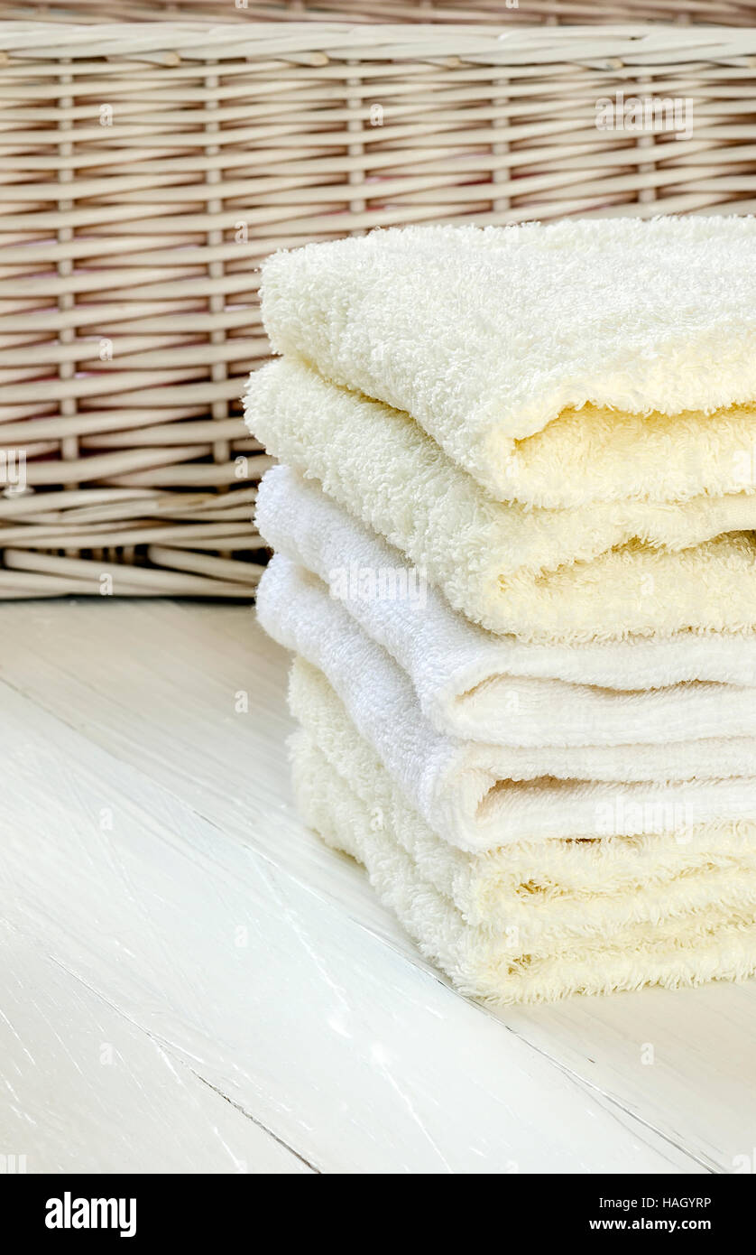 Stack of towels on white wooden background Stock Photo - Alamy