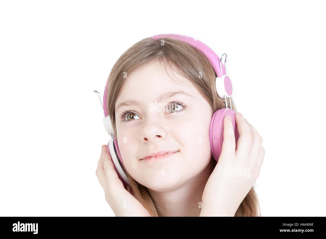 portrait of the young beautiful girl in earphones, on a white ...