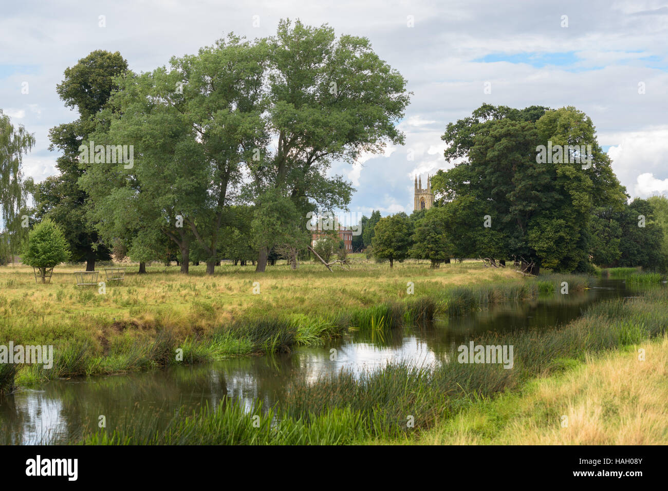 English countryside stream with cathedral in distance Stock Photo - Alamy
