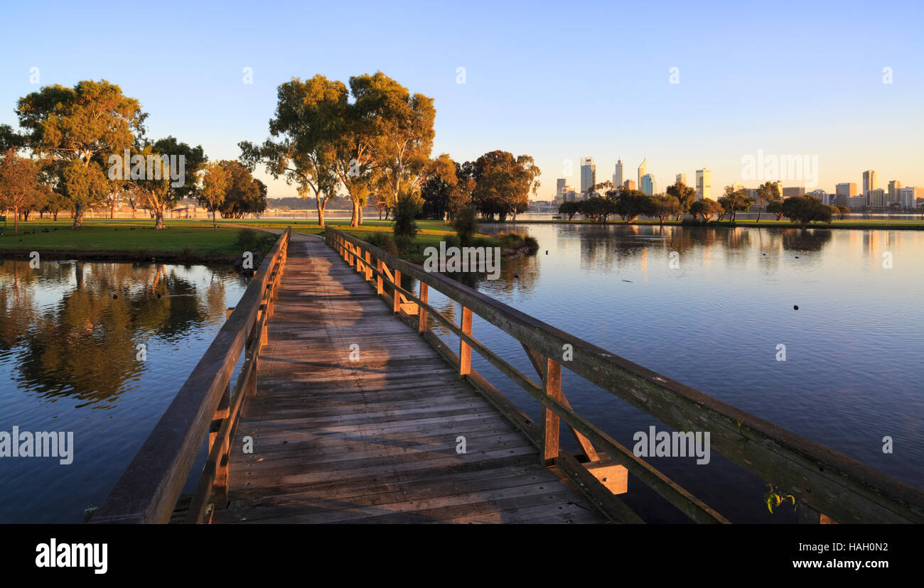 A footbridge over a lake in Sir James Mitchell Park, South Perth, with ...