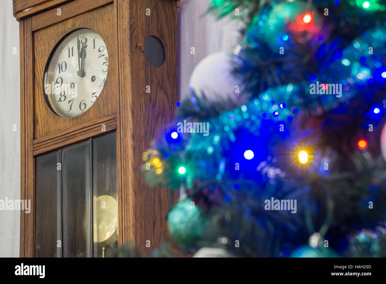 Vintage chiming wall clock on midnight at Christmas Stock Photo - Alamy