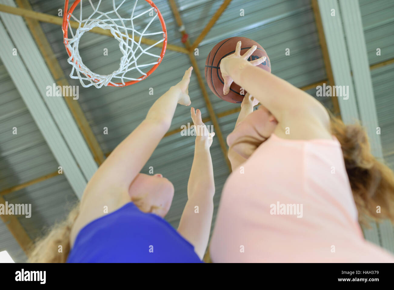 Women shooting basketball Stock Photo - Alamy