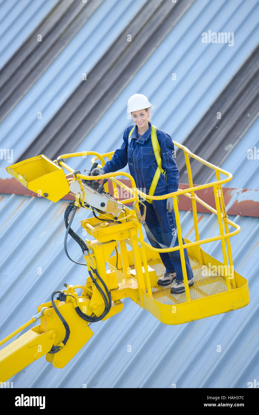 Woman in cherry picker cage hi-res stock photography and images - Alamy