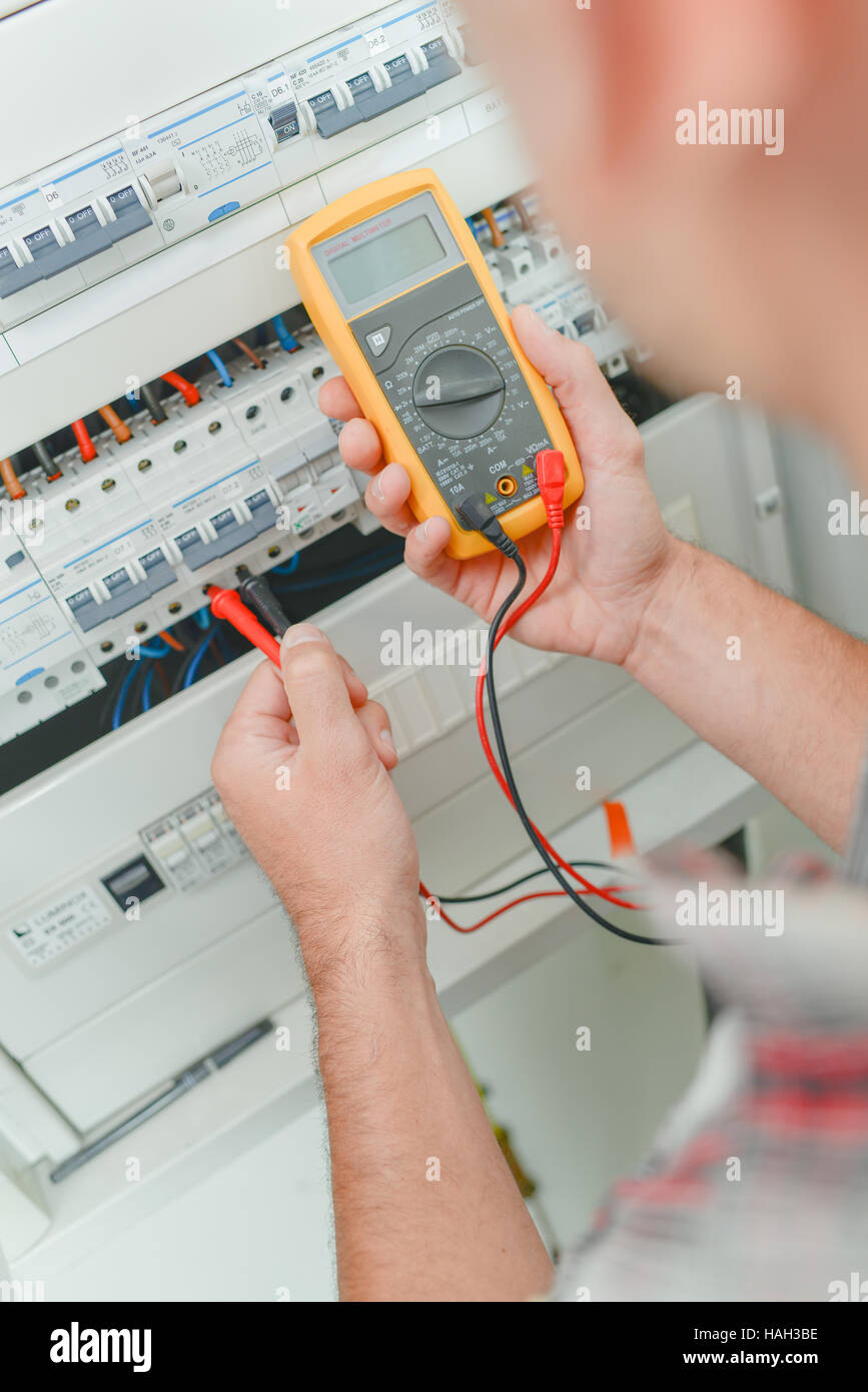 Man using multi meter Stock Photo - Alamy