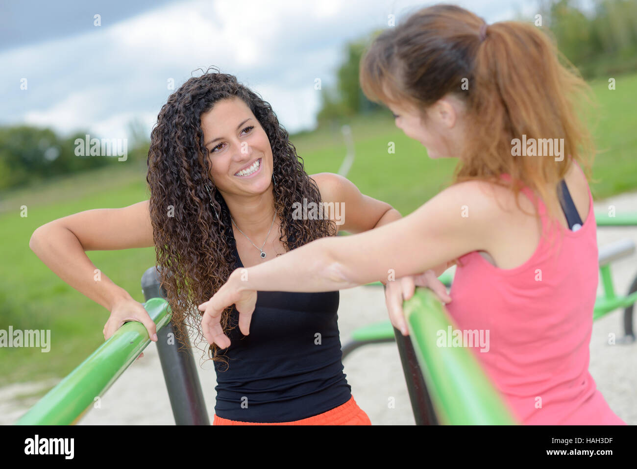 Women chatting in park Stock Photo - Alamy