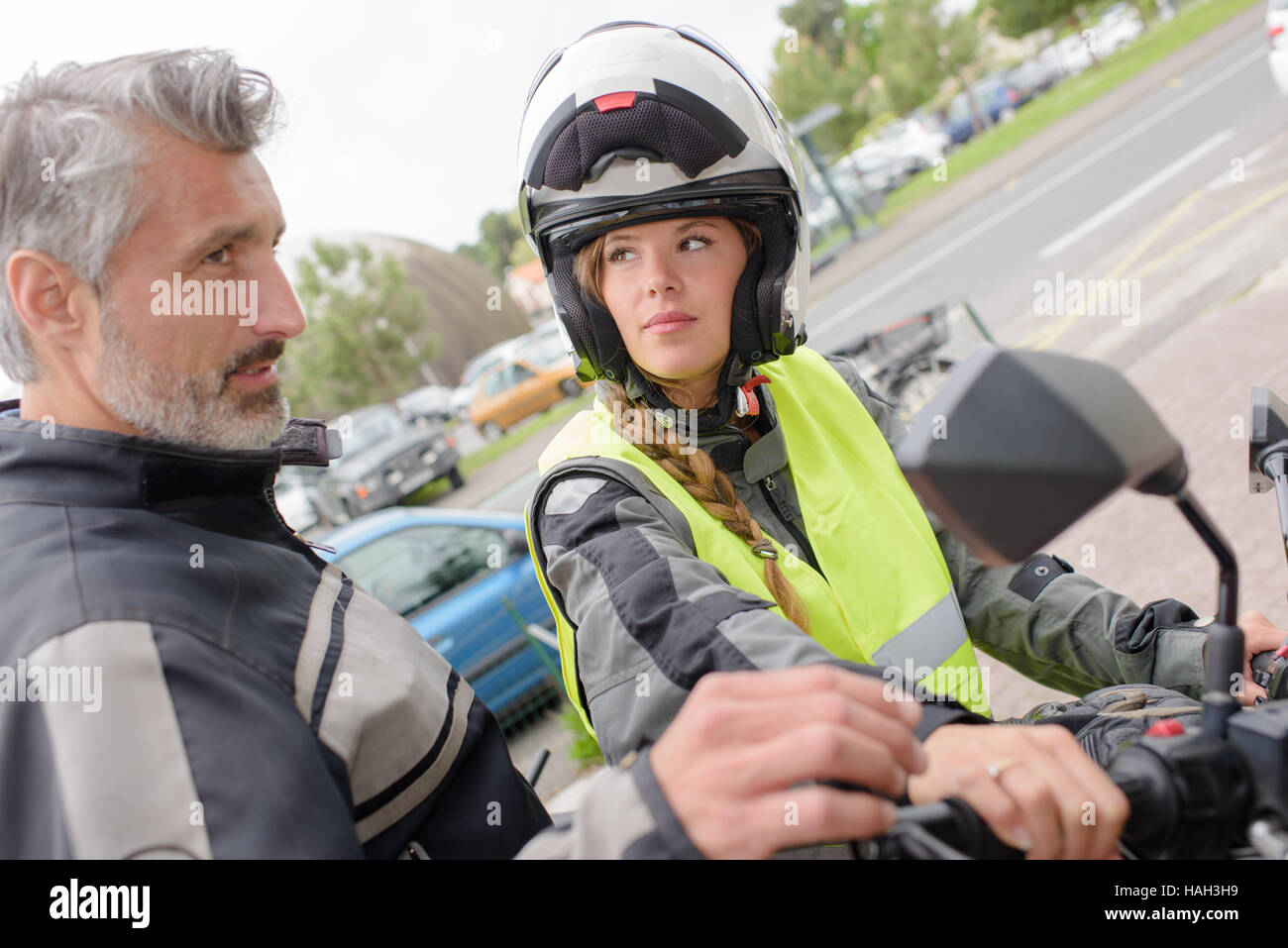 Woman having driving lesson on a motorcycle Stock Photo - Alamy