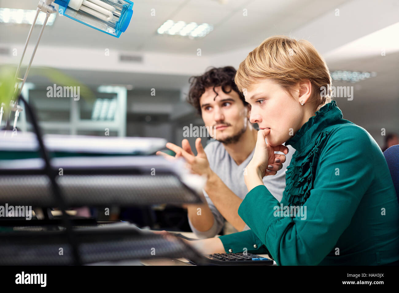 The concept of office work. Business woman thinking behind compu Stock ...