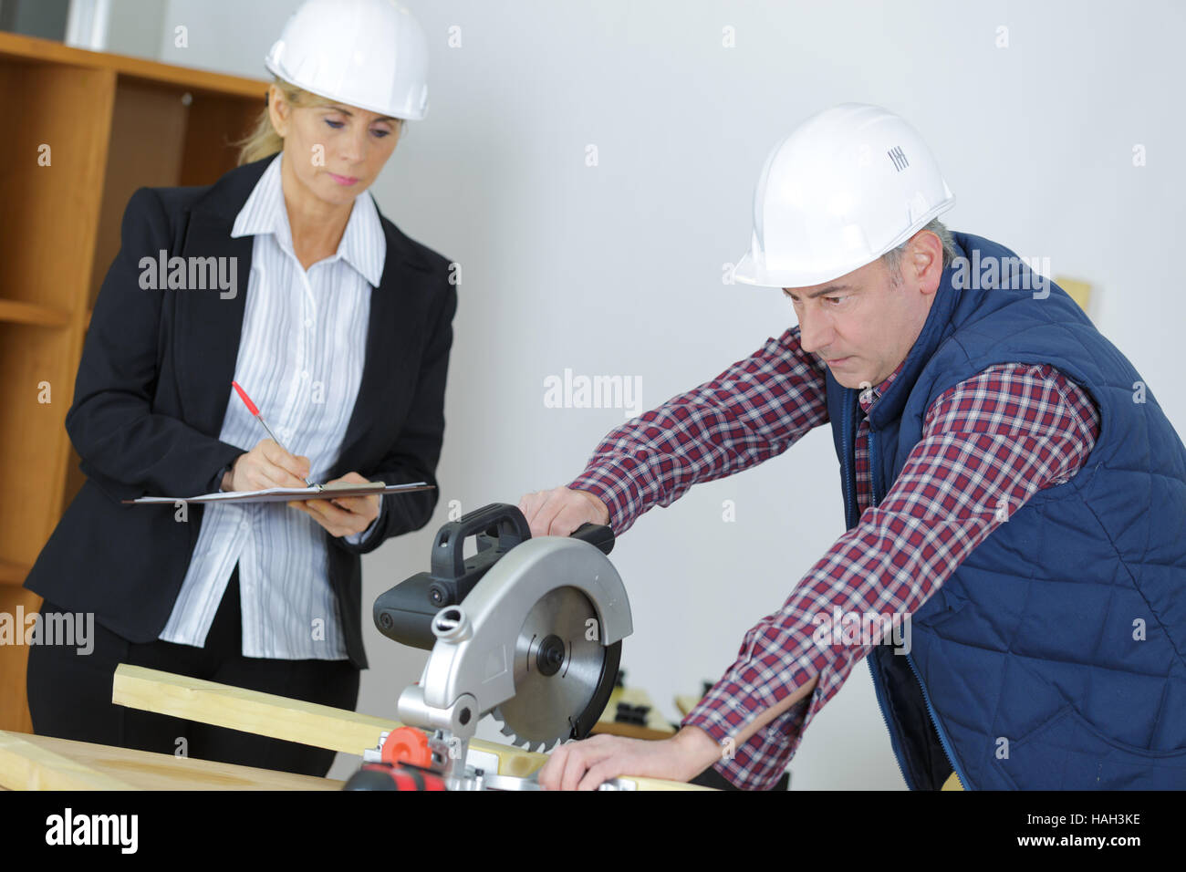 carpenter and businesswoman Stock Photo - Alamy