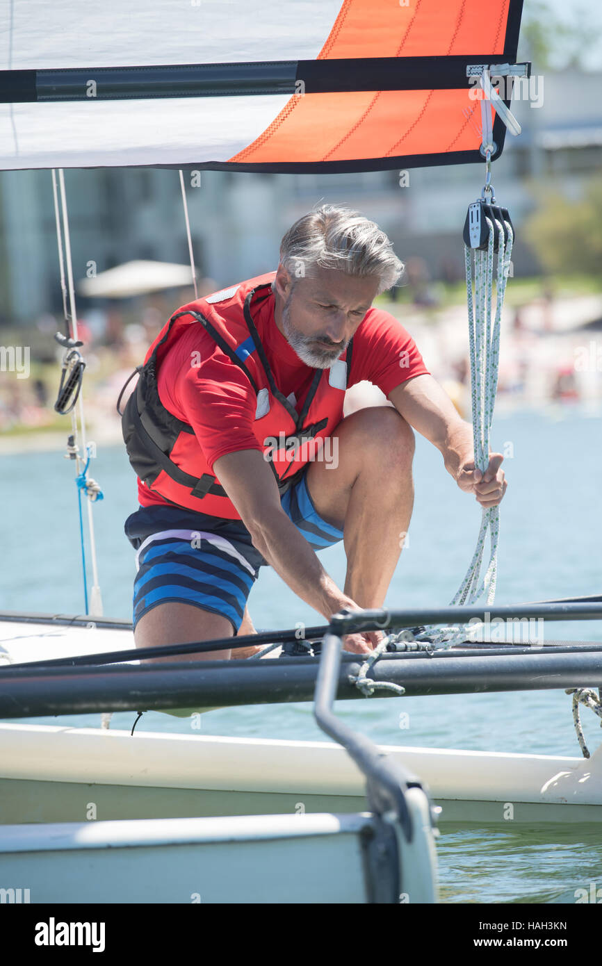 professional waterman training on lake with catamaran Stock Photo - Alamy