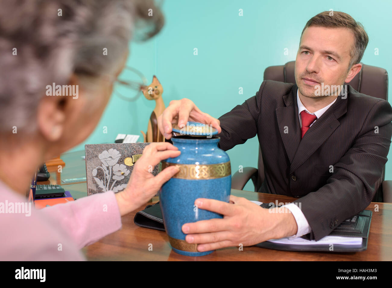 handling over the jar Stock Photo - Alamy
