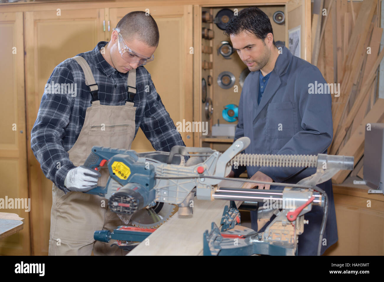 Man using industrial saw Stock Photo - Alamy