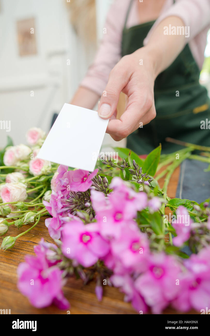 Woman passing flowers hi-res stock photography and images - Alamy