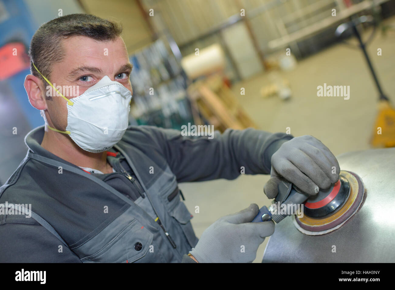 Man using sander Stock Photo - Alamy