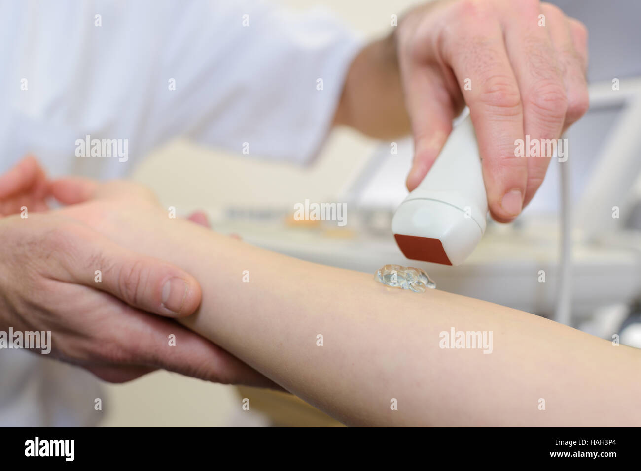 Medical instrument poised to scan arm Stock Photo - Alamy