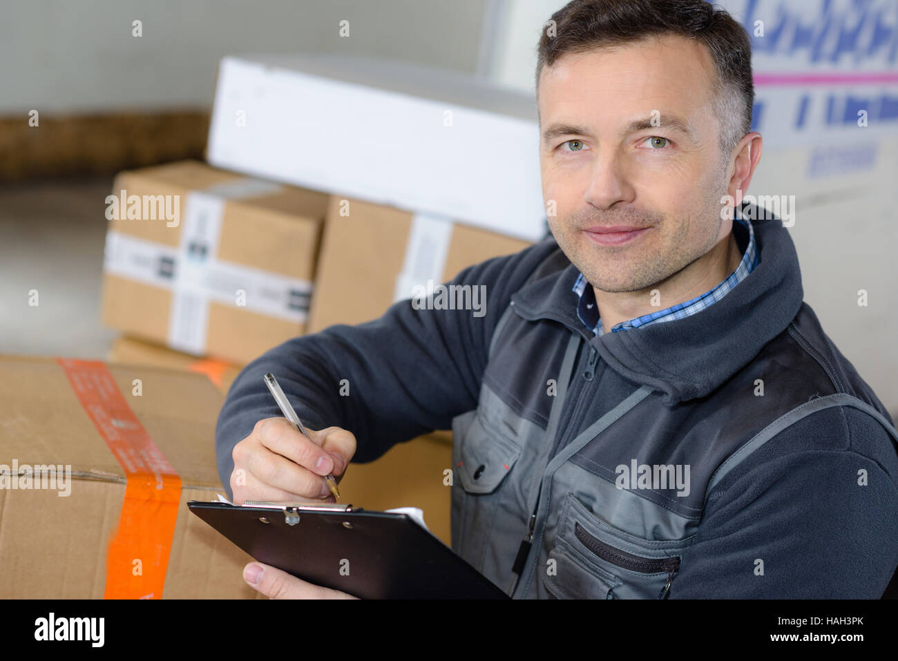 delivery man with parcel near cargo truck shipping service Stock Photo ...
