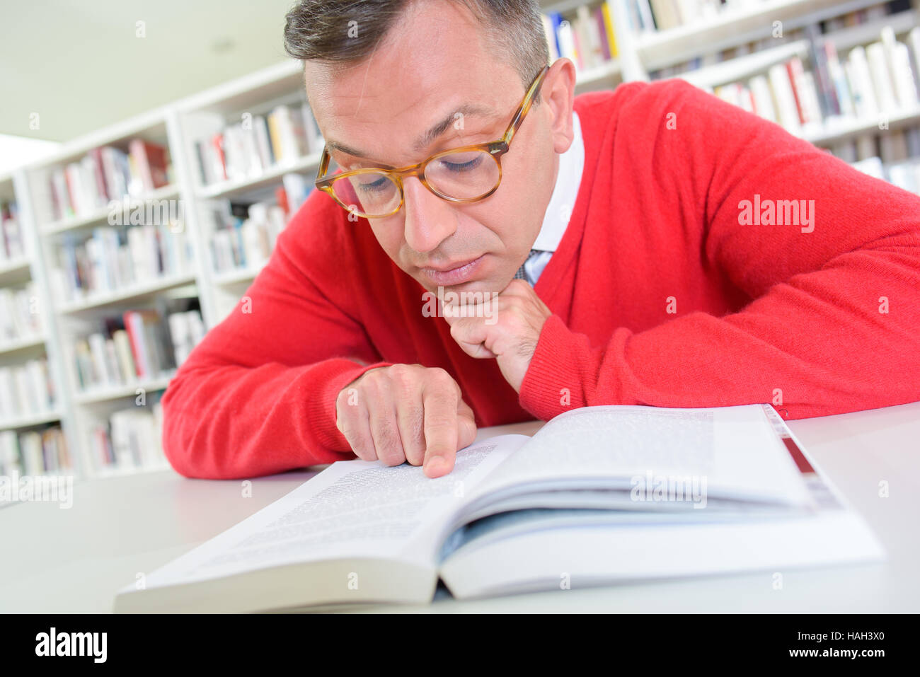 reading slowly with glasses Stock Photo - Alamy