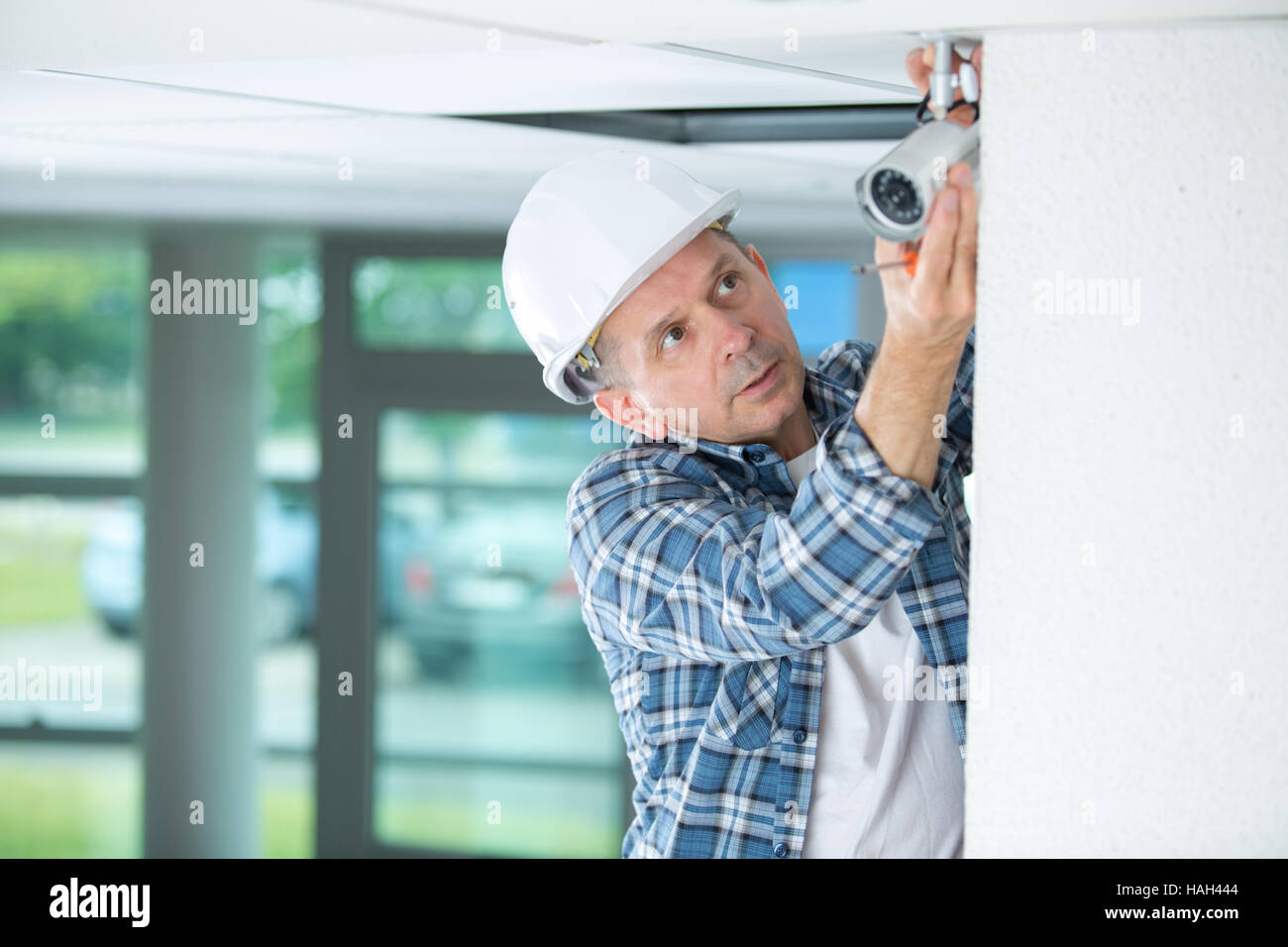 professional cctv technician working Stock Photo - Alamy
