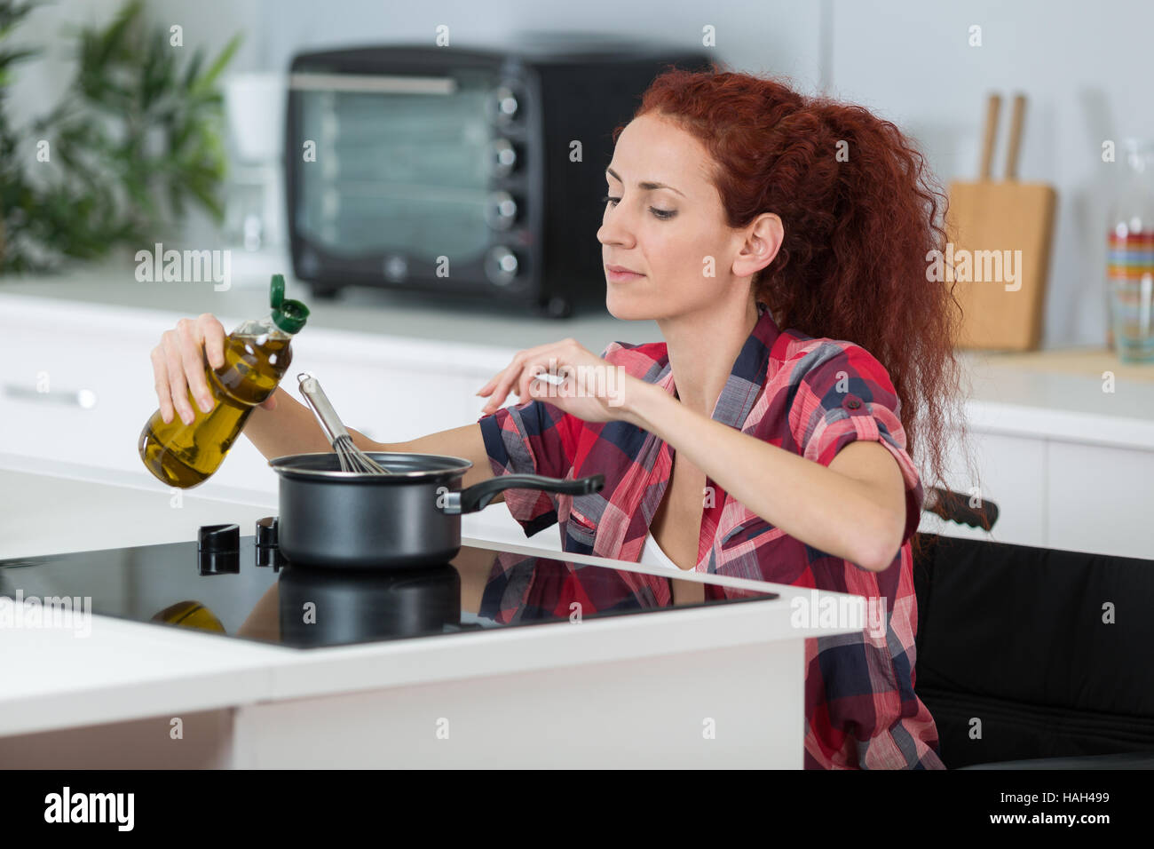 disabled woman cooking in her kitchen Stock Photo - Alamy