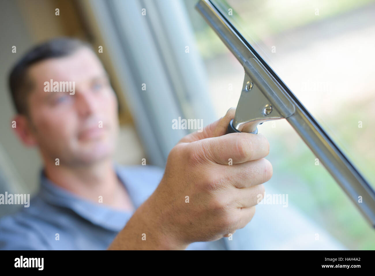 Close up of man cleaning windows Stock Photo - Alamy