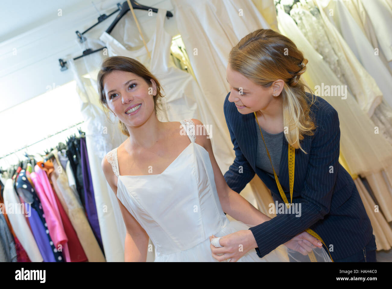 bride-to-be trying on wedding dress at a dress fitting Stock Photo - Alamy