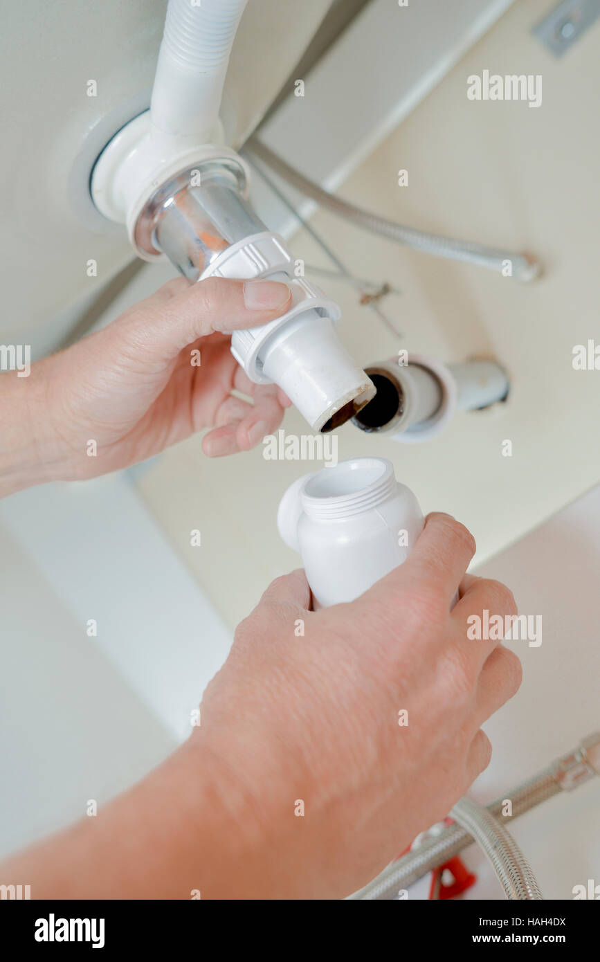 Fixing a sink Stock Photo - Alamy