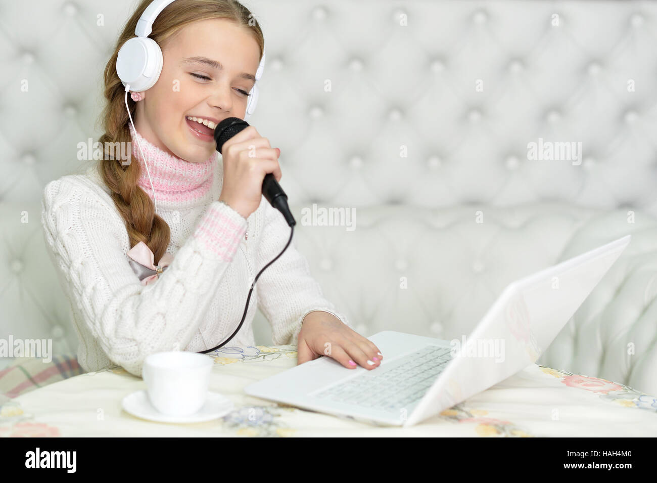 Girl singing karaoke Stock Photo - Alamy