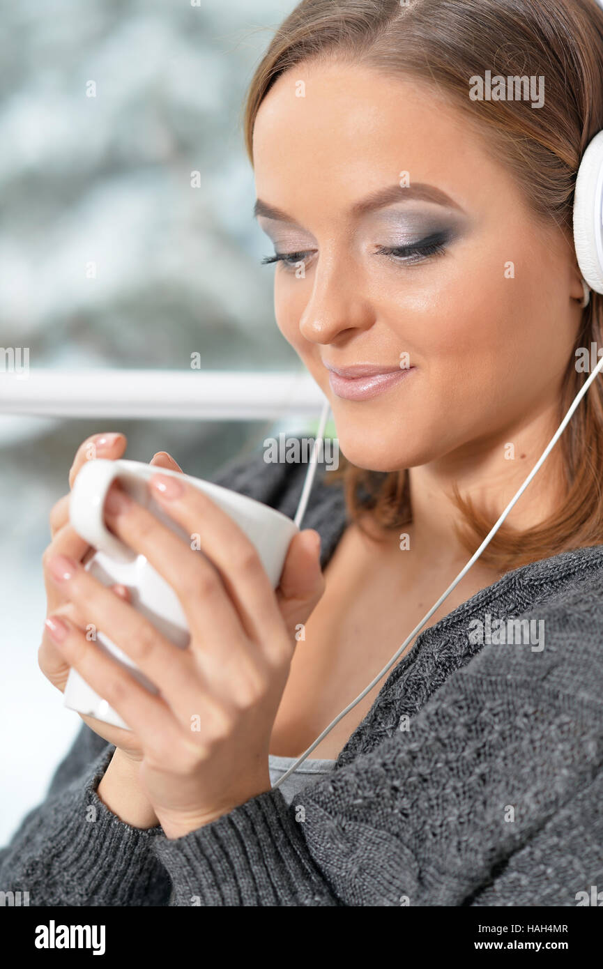 Girl drinking tea Stock Photo - Alamy