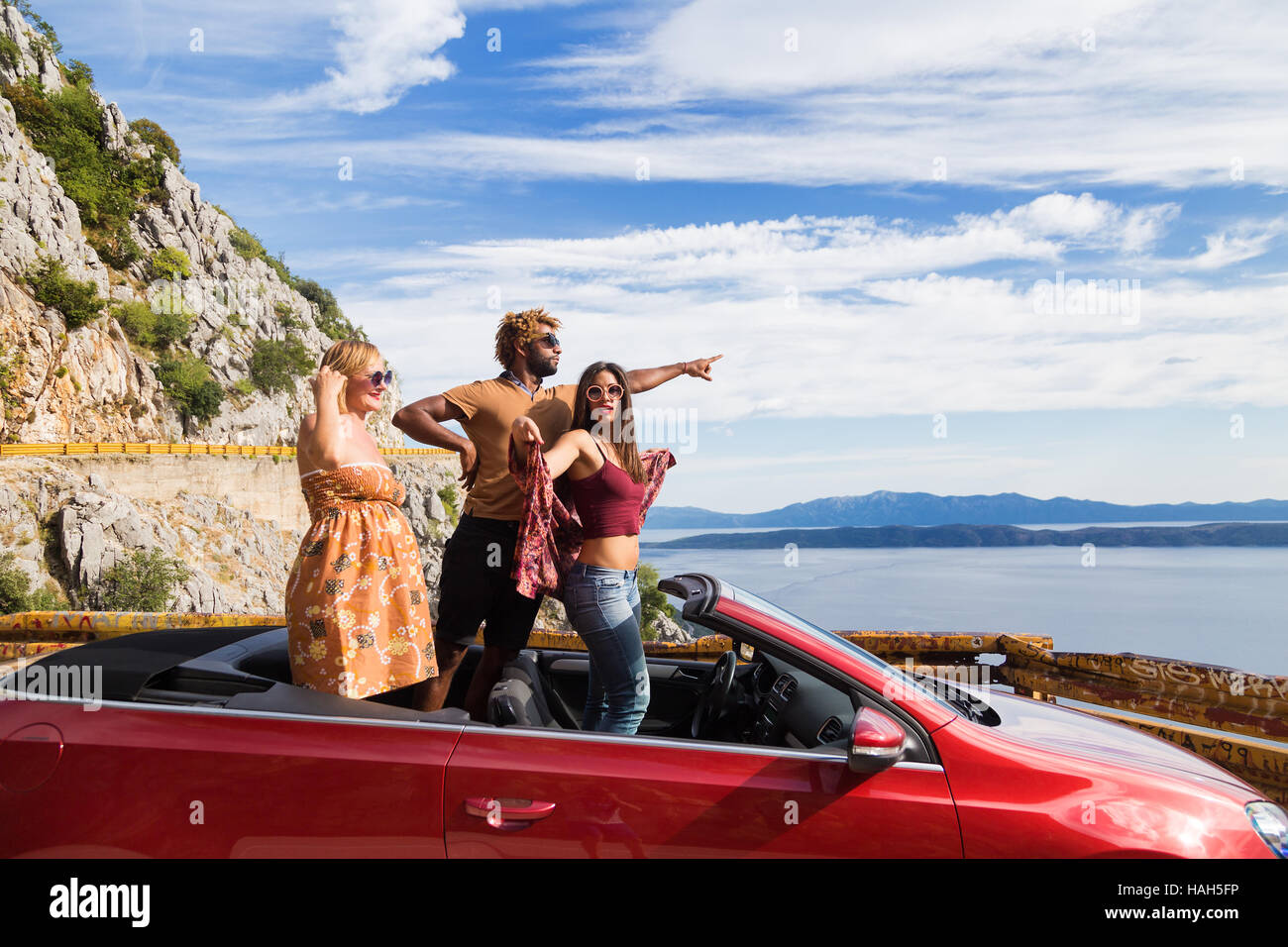 Retro woman pointing car hi-res stock photography and images - Alamy