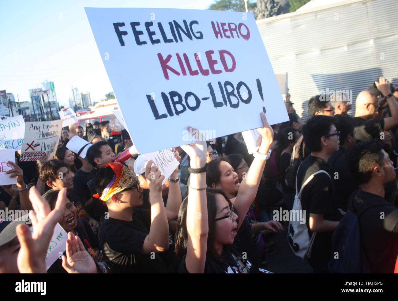 Filipino protesters participate in a rally at the People Power Monument ...