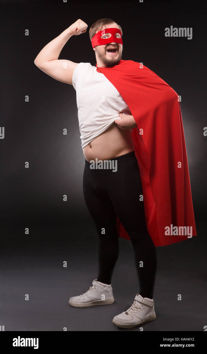 Young super hero man in studio Stock Photo - Alamy