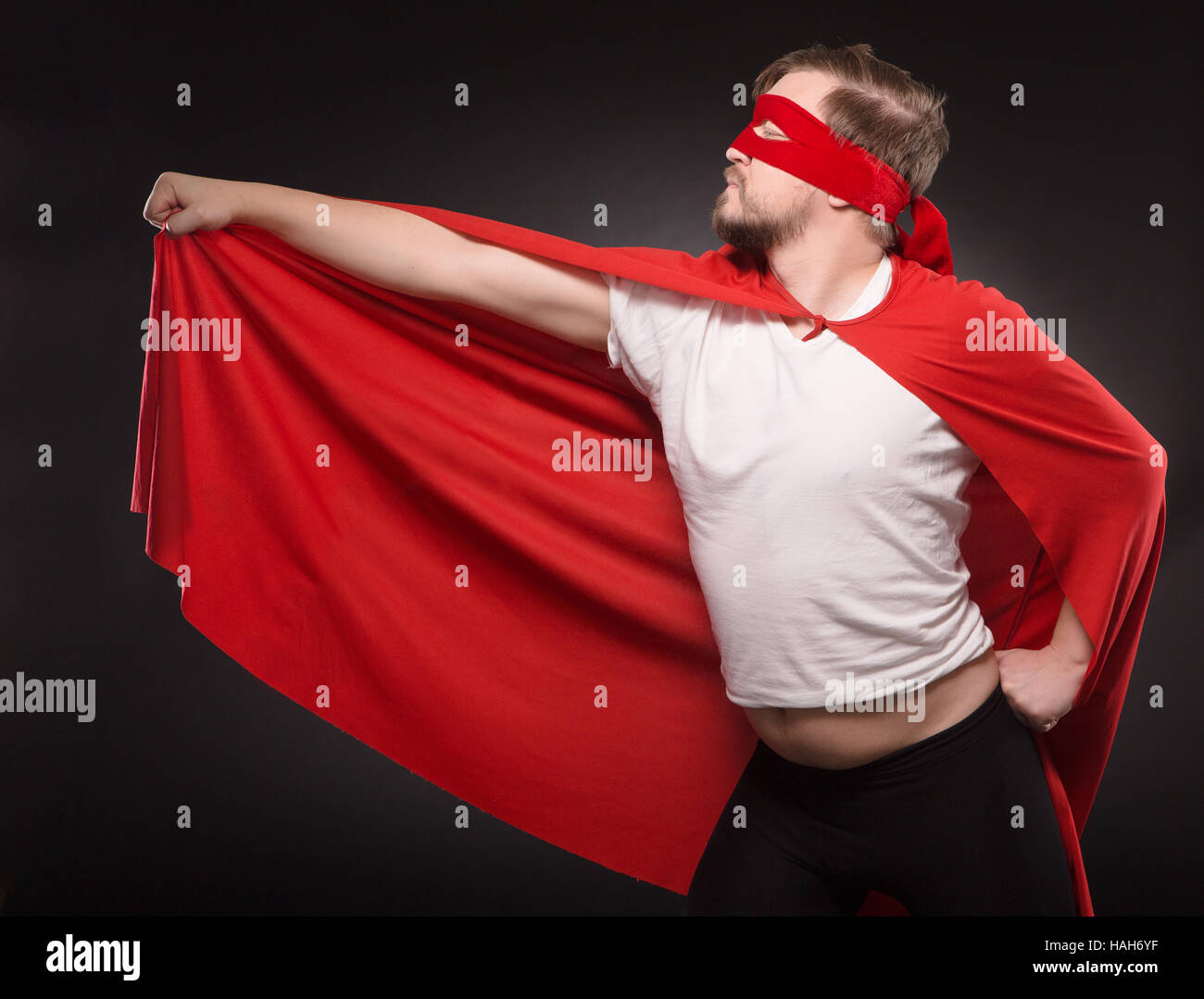 Young super hero man in studio Stock Photo - Alamy