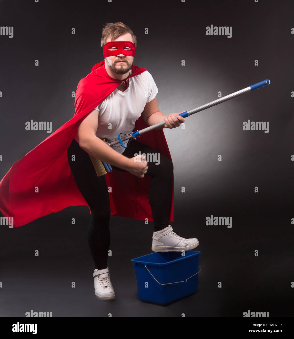 Super hero with cleaning equipment Stock Photo - Alamy