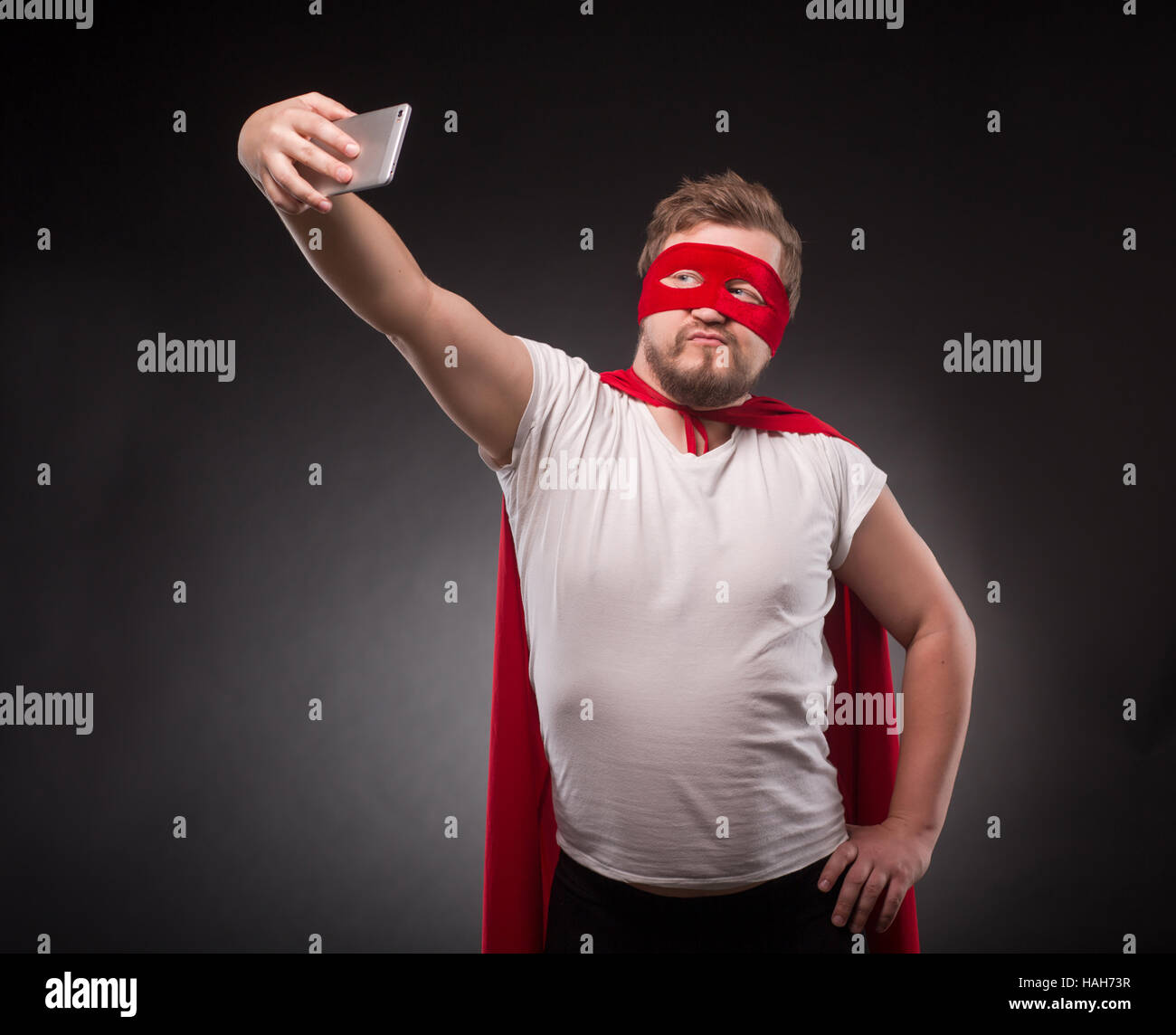 Super hero man making photos Stock Photo - Alamy