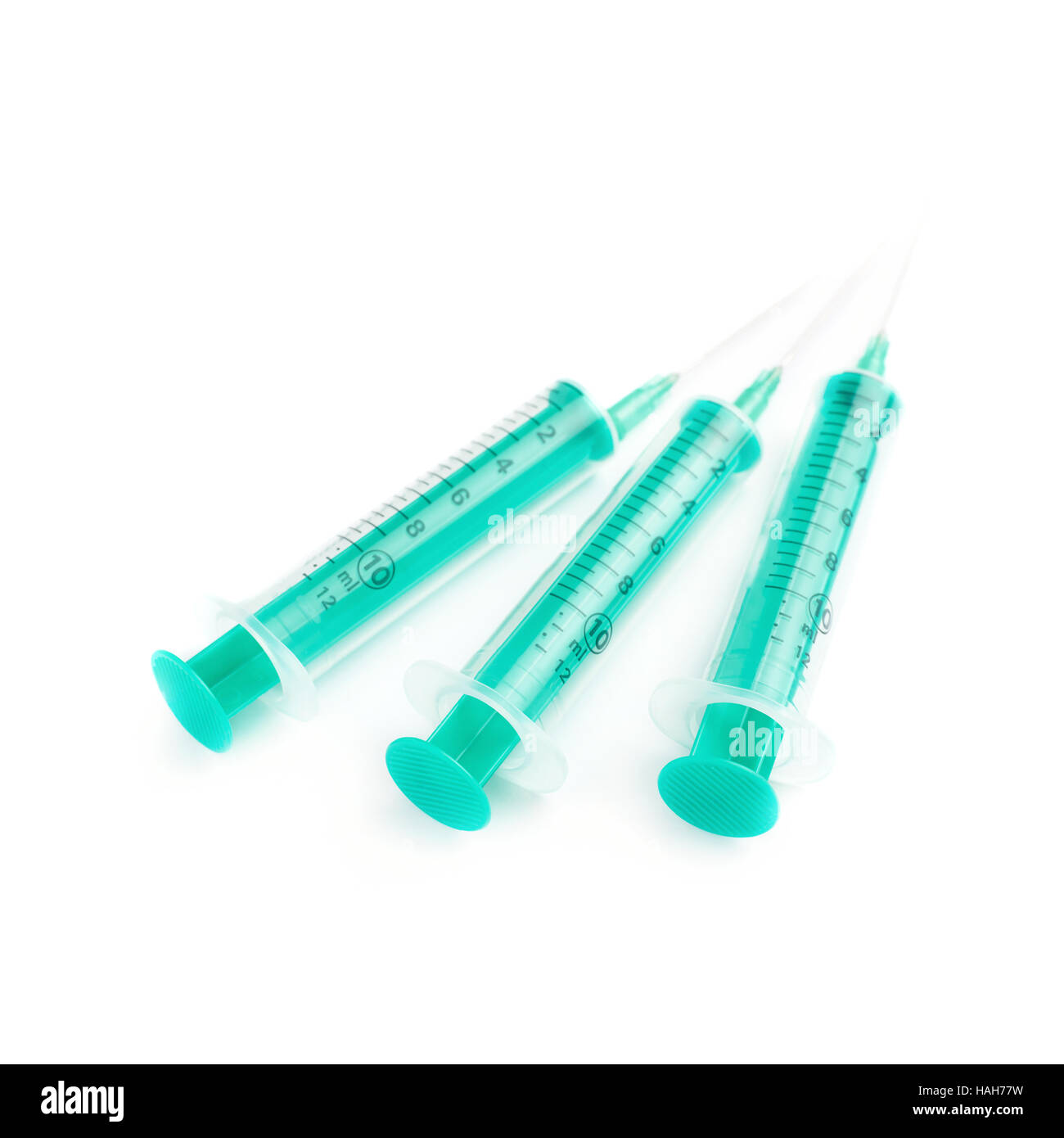 Medical syringes with needles lying isolated over white background ...