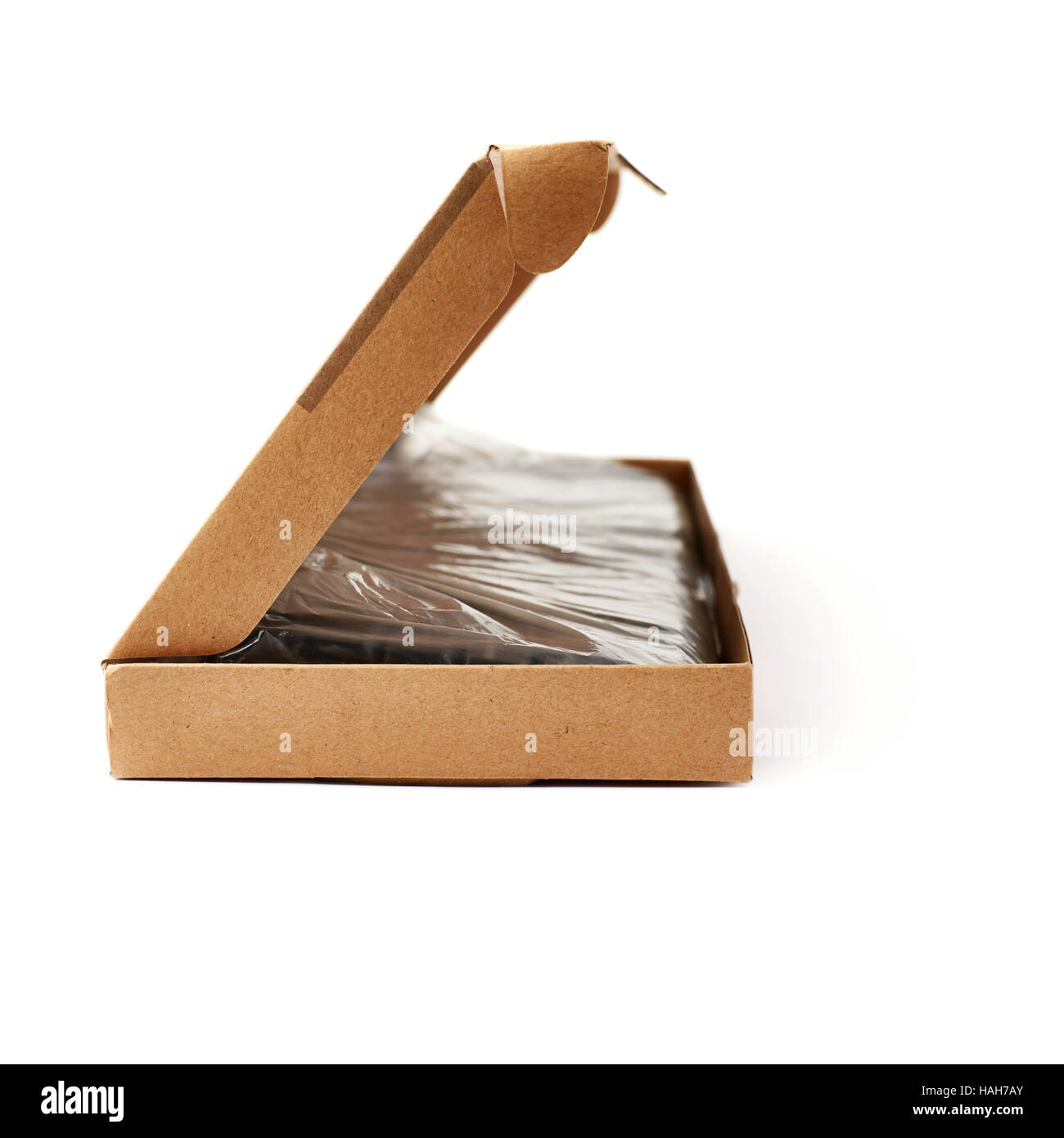 Keyboard packed into cardboard box isolated over white background Stock ...