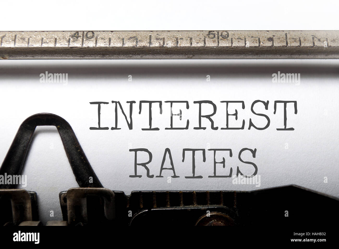 Interest rates headline printed on an old typewriter Stock Photo - Alamy