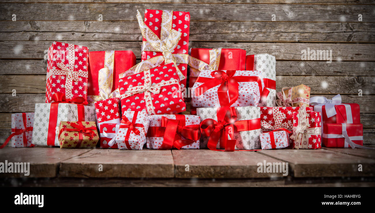 Christmas background with pile of gifts placed on snow Stock Photo - Alamy