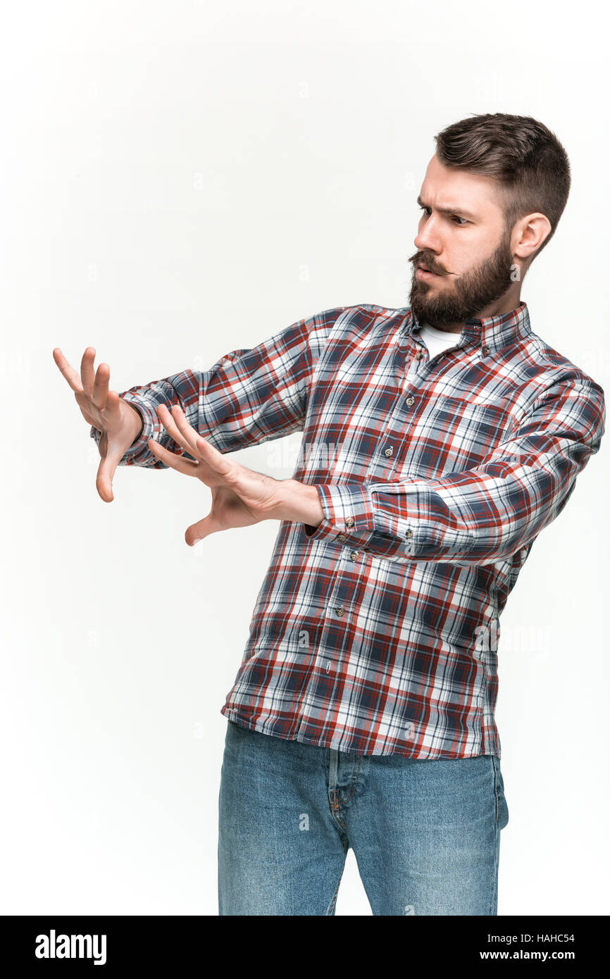 Man is looking scared. Over white background Stock Photo - Alamy