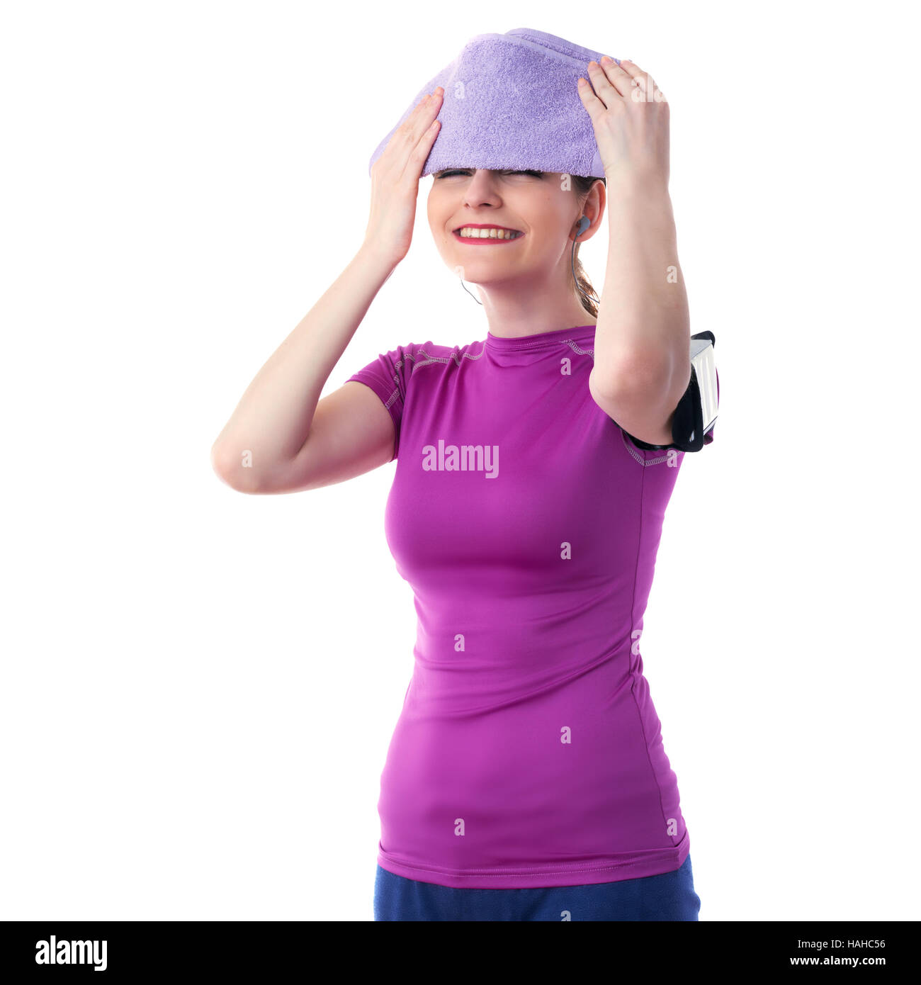 Smiling sporty woman in violet T-short over white isolated background ...