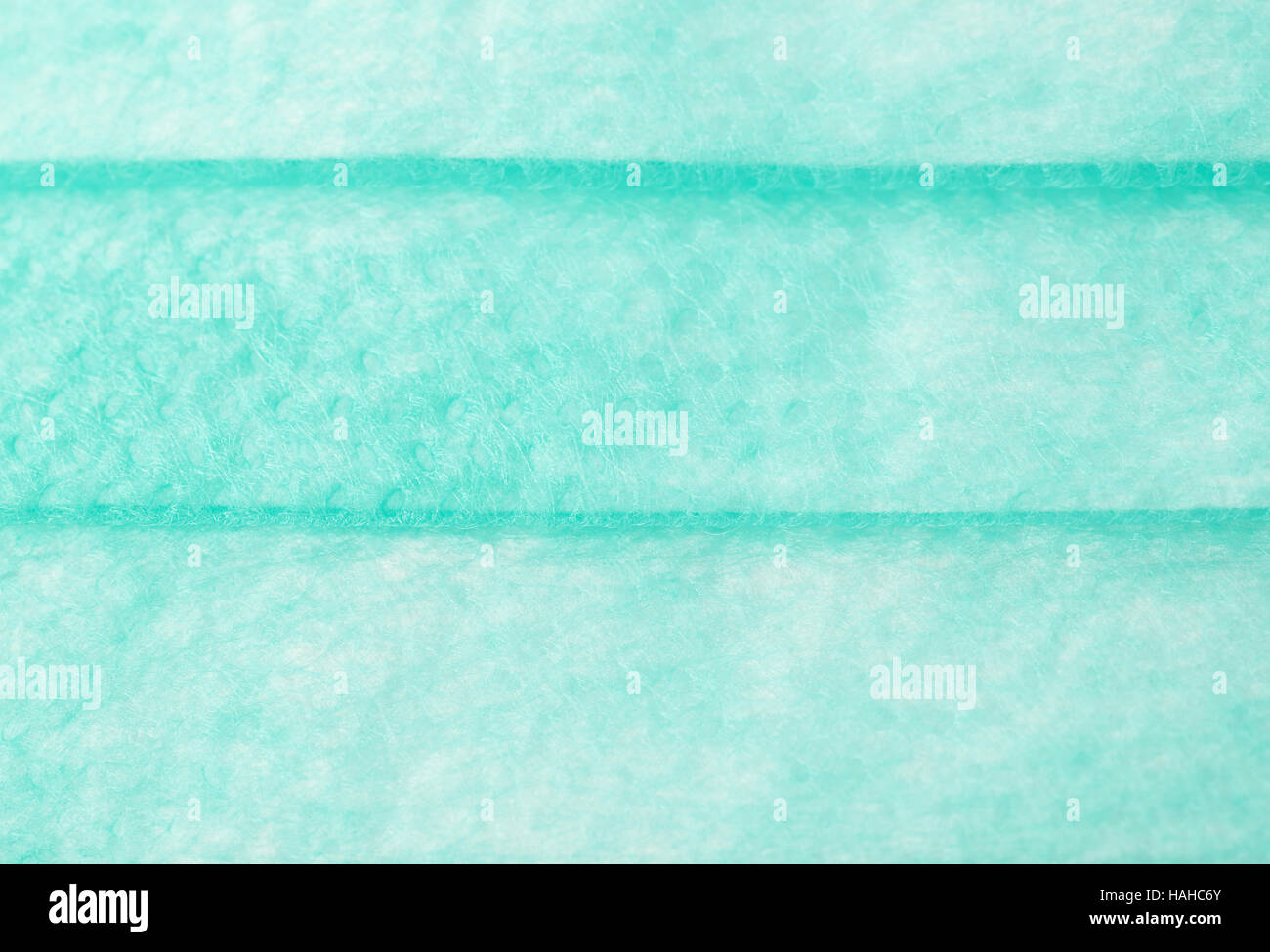 Green medical surgical protective mask texture as abstract background ...