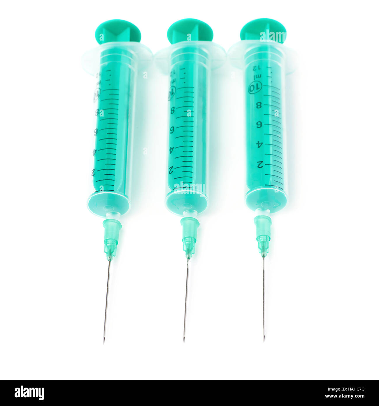 Medical syringes with needles lying isolated over white background ...