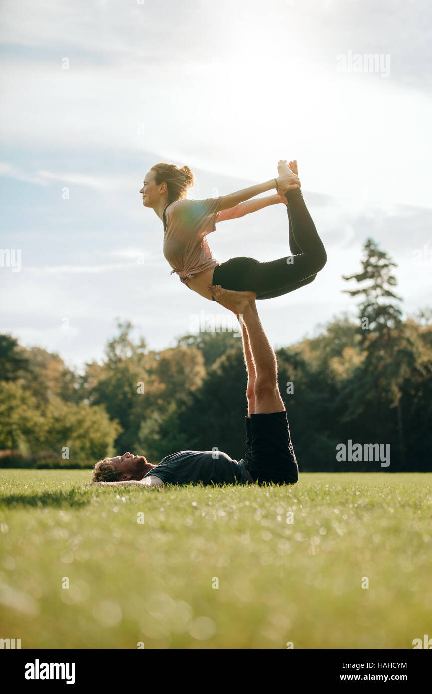 Strong acrobatic woman lifting man hi-res stock photography and images ...