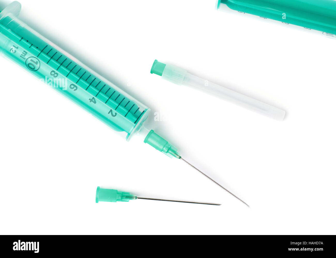 Medical syringes with needles lying isolated over white background ...